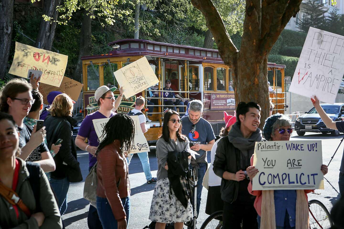 Pro-immigrant demonstrators rally outside Peter Thiel’s SF home