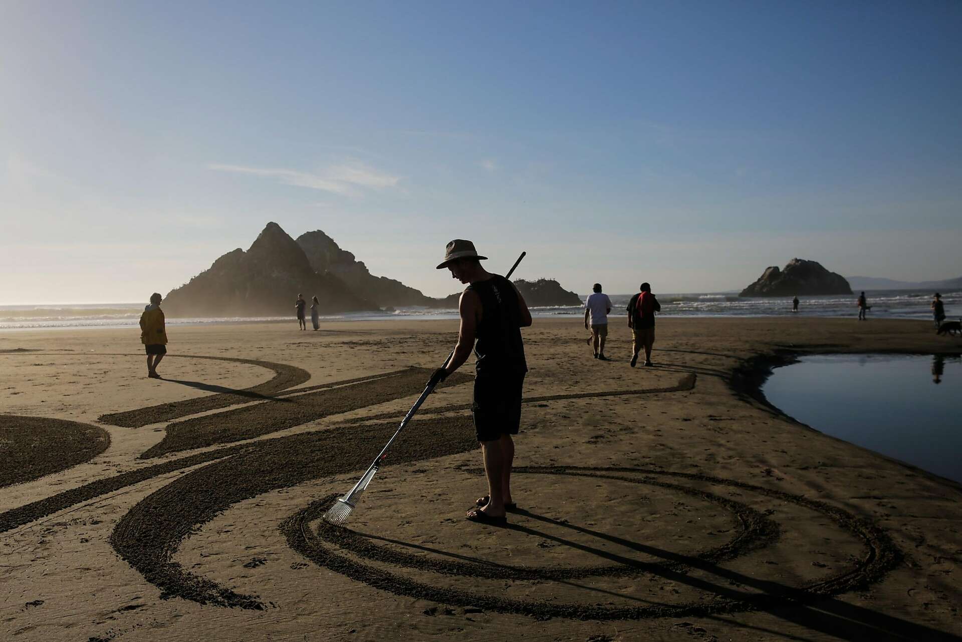 Rake artist uses beach as canvas