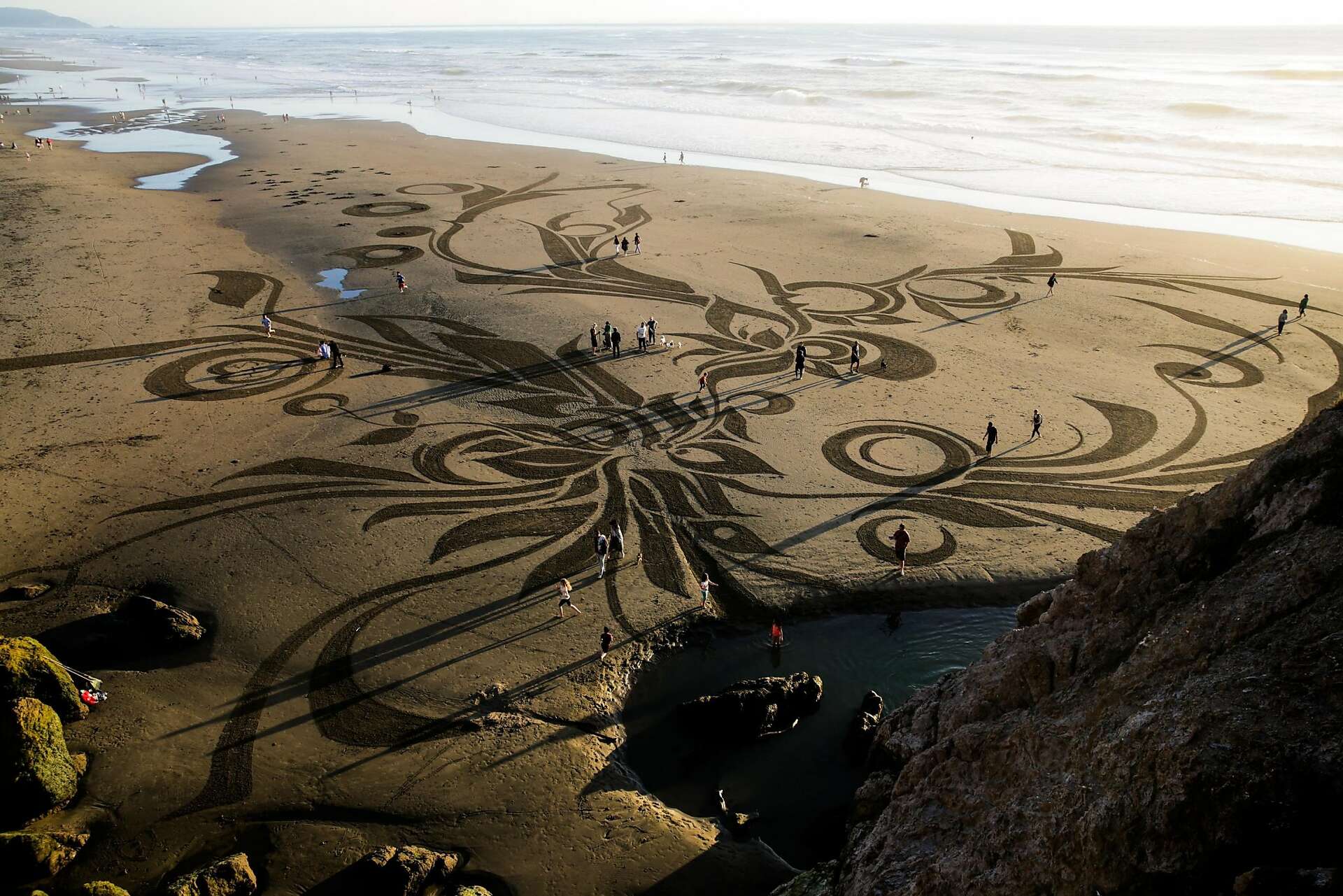 Rake artist uses beach as canvas