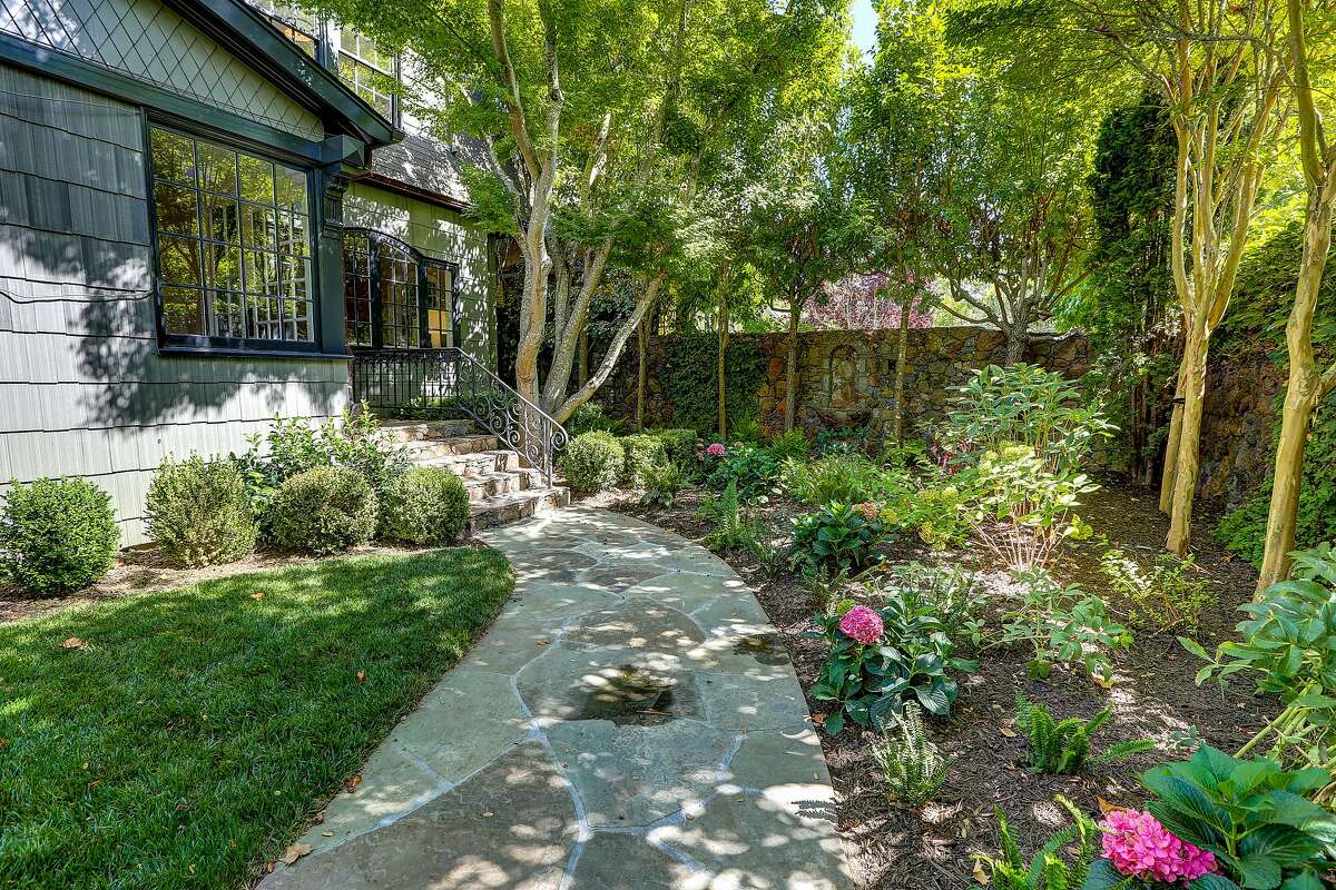 Soothing style, welcoming pool patio defines Dutch Colonial in Ross