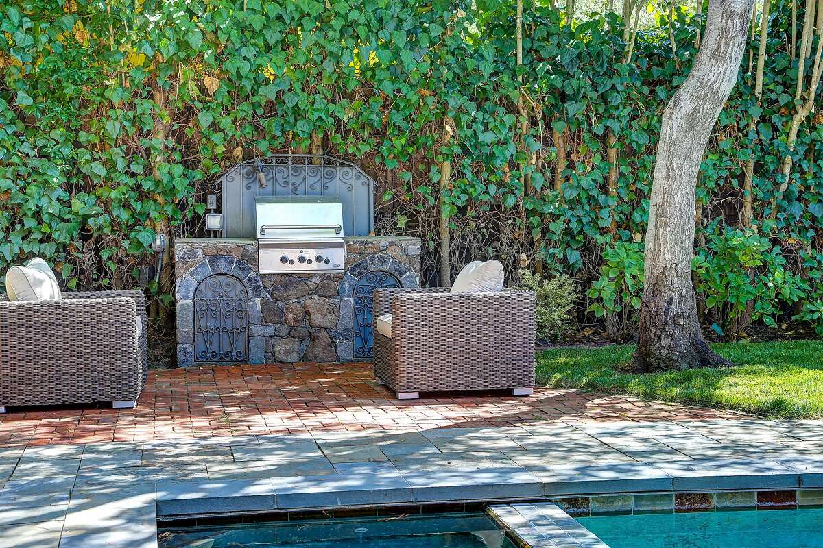 Soothing style, welcoming pool patio defines Dutch Colonial in Ross