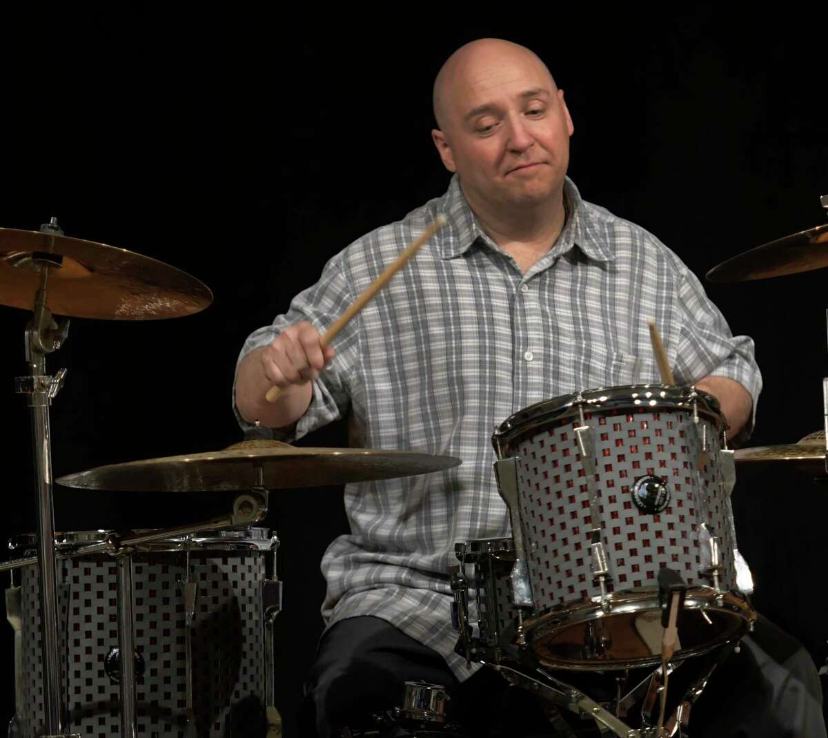 Musician plays drum set made of Legos