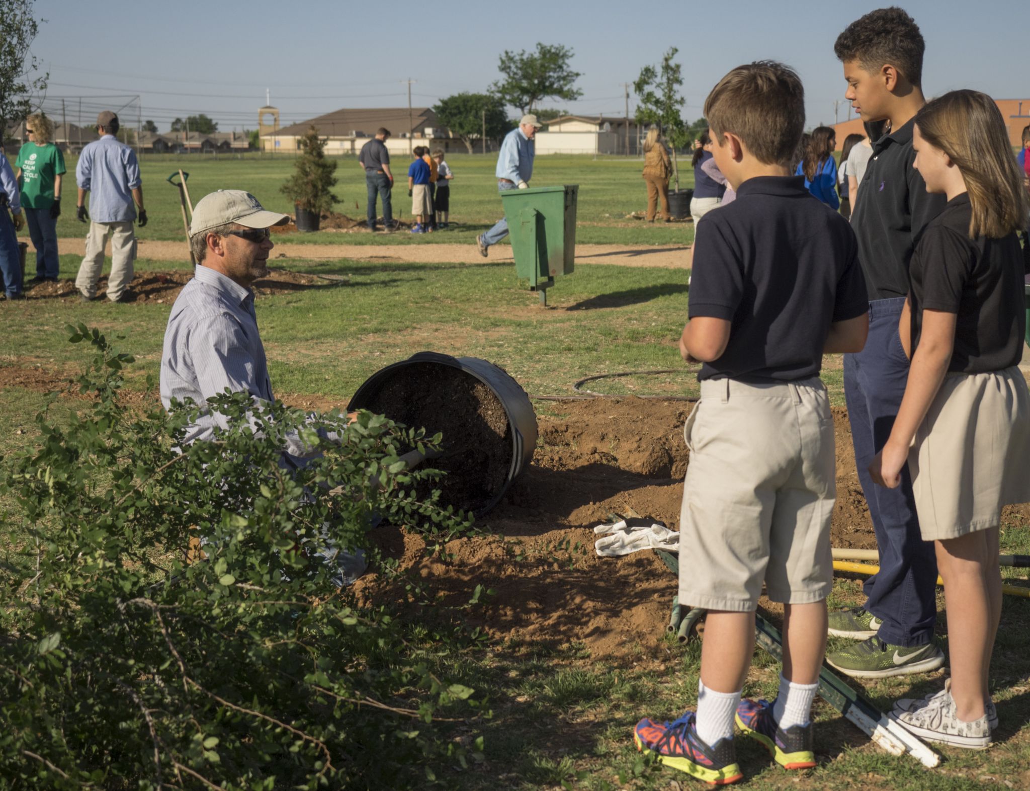Henderson Elementary students help plant trees in celebration of Arbor Day