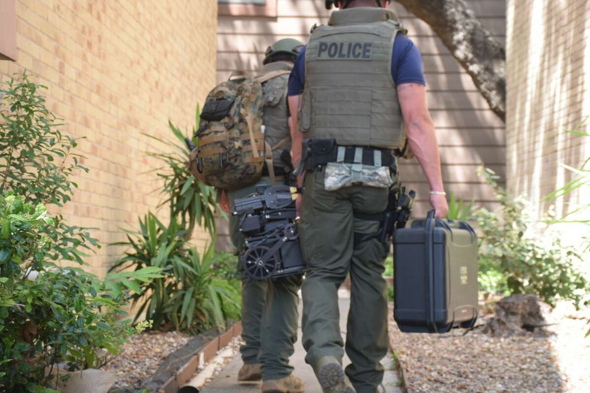 Heavily armed police subdue man after hours-long SWAT situation at ...