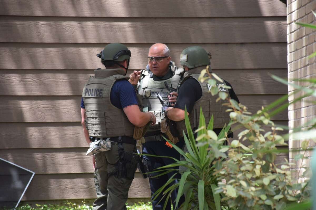 Heavily armed police subdue man after hours-long SWAT situation at ...
