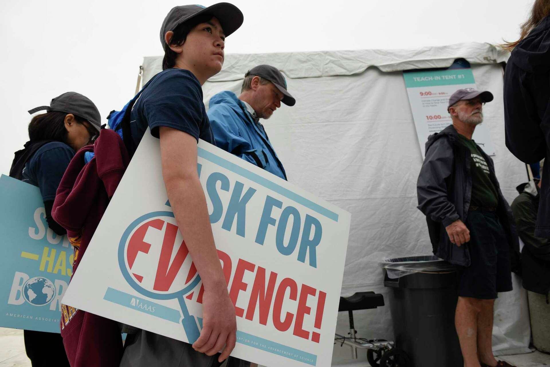 Scientists leave labs, take to streets to defend research