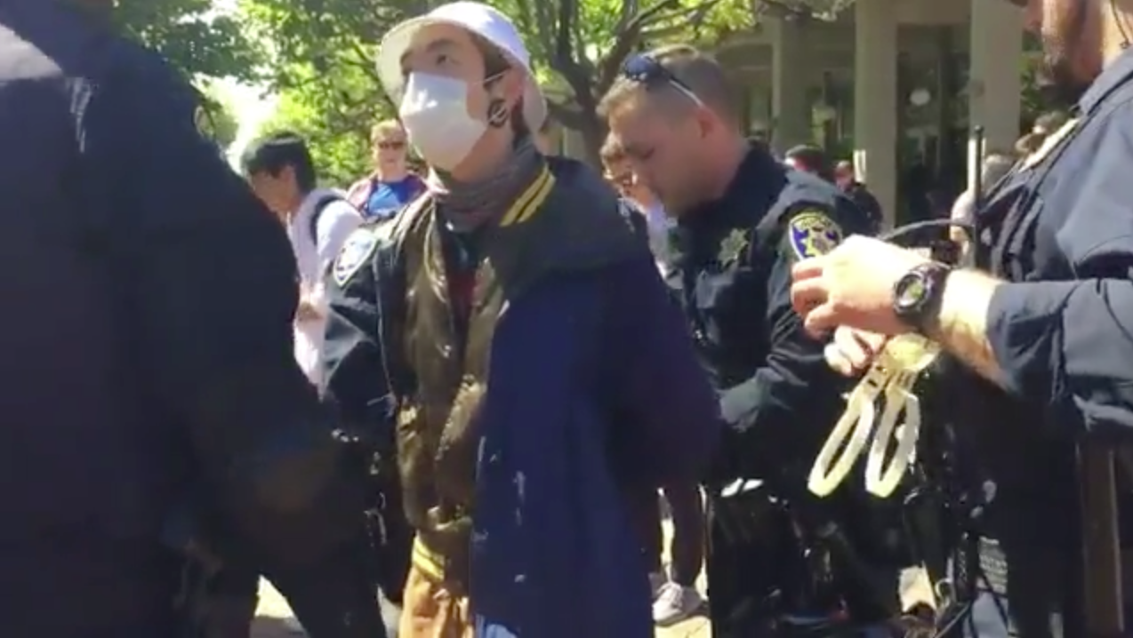 Protester at UC Berkeley who refuses to remove mask is cuffed and arrested