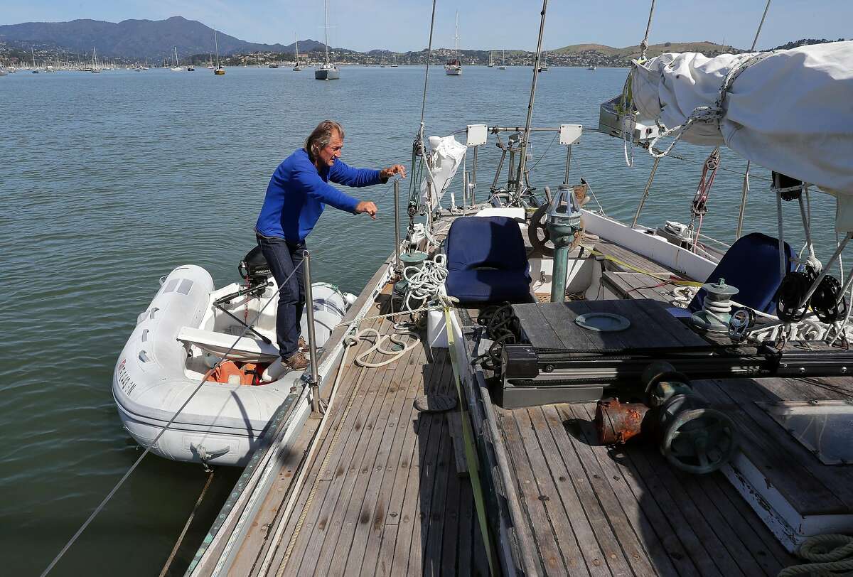 As more ‘anchor-outs’ live on SF Bay, tension mounts on land