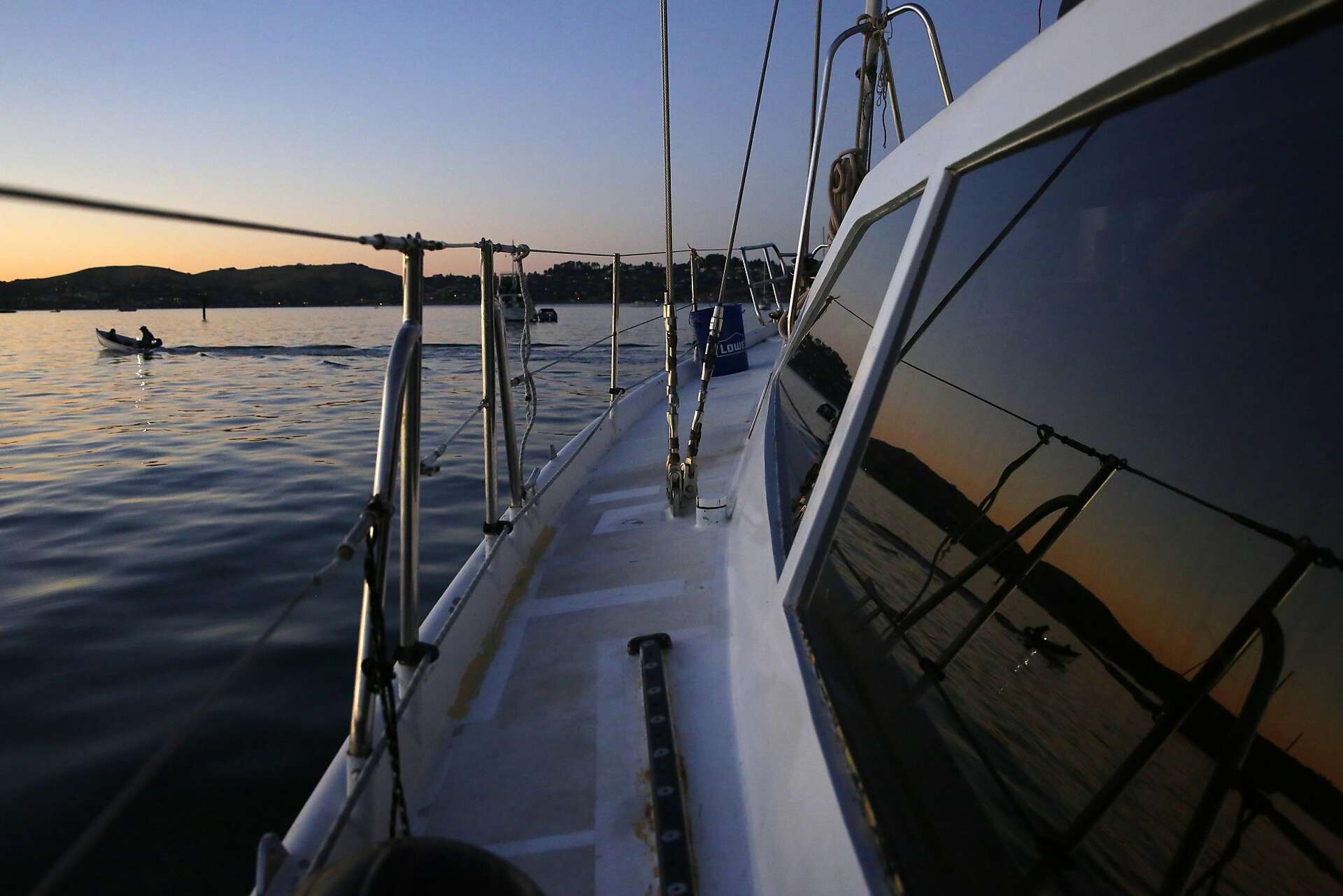 As more ‘anchor-outs’ live on SF Bay, tension mounts on land