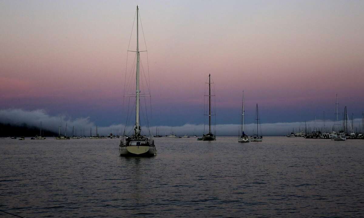 As more ‘anchor-outs’ live on SF Bay, tension mounts on land