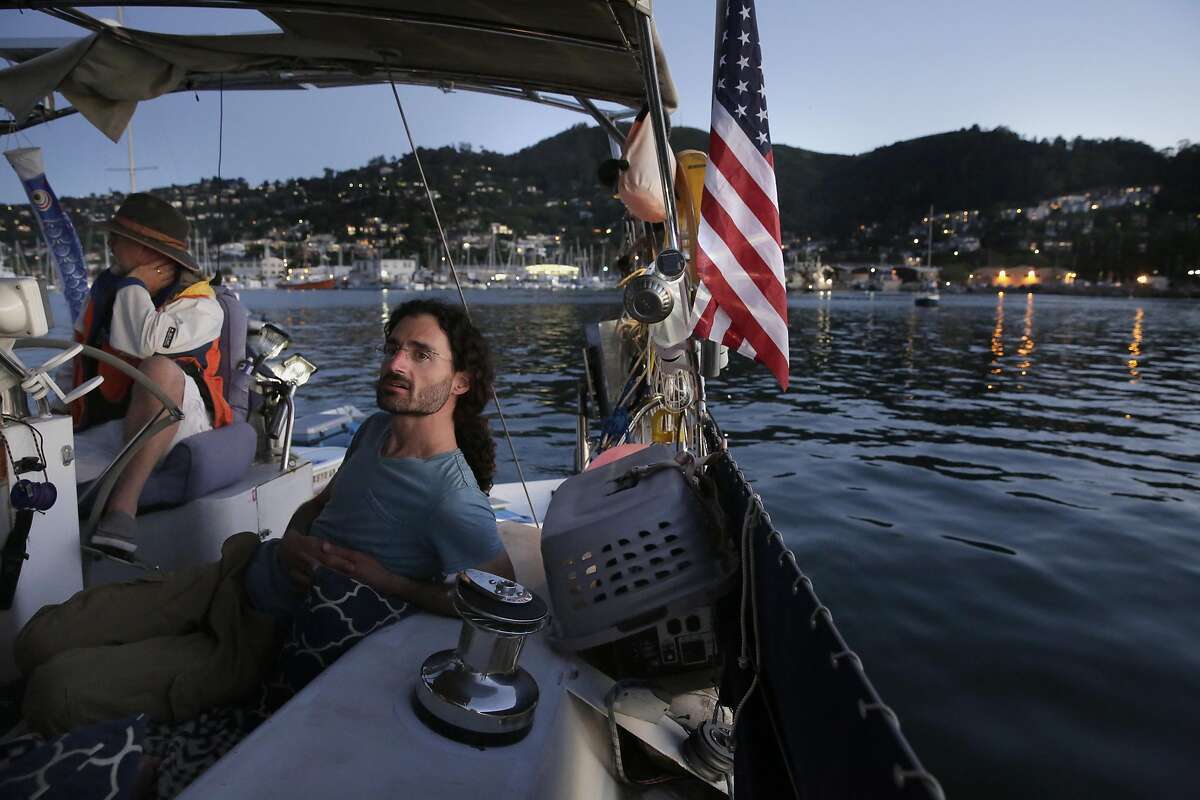As more ‘anchor-outs’ live on SF Bay, tension mounts on land