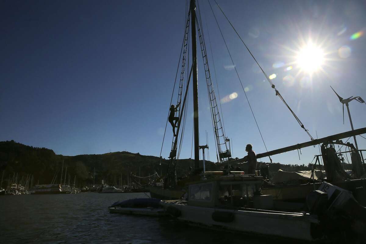 As more ‘anchor-outs’ live on SF Bay, tension mounts on land