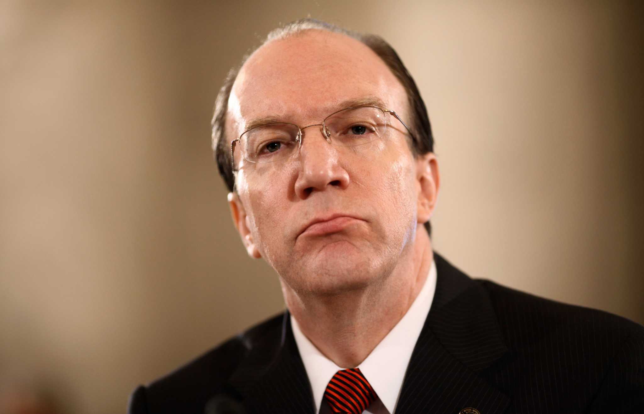 Abbott fires inspector general for moonlighting as Iraq consultant