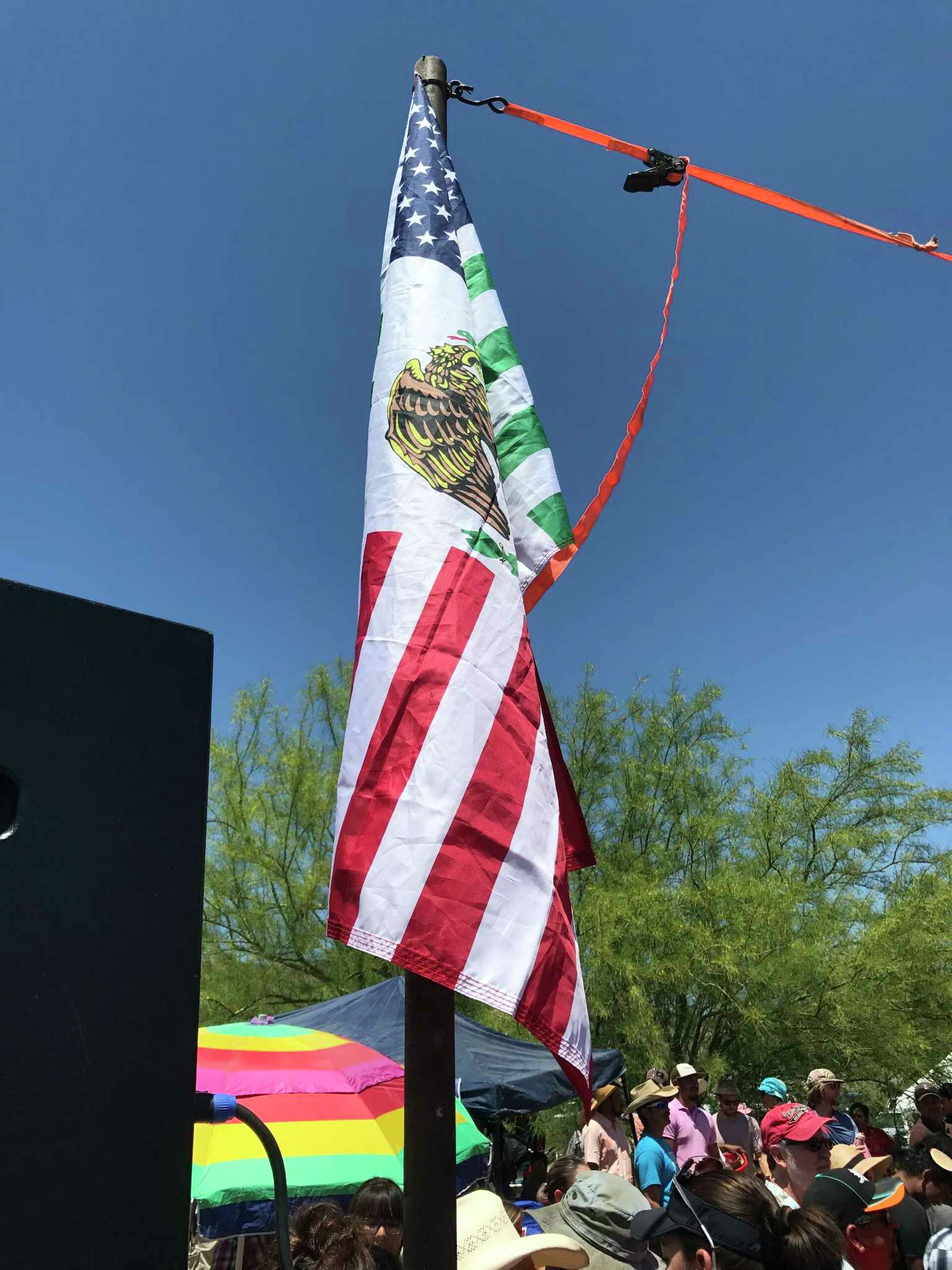 A festive crowd gathers in the middle of the Rio Grande for a 'fiesta ...