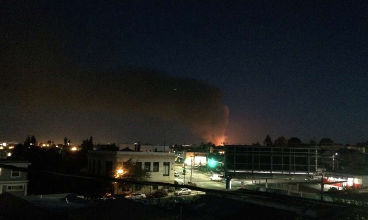 Fire crews work on still-smoldering debris from Emeryville complex