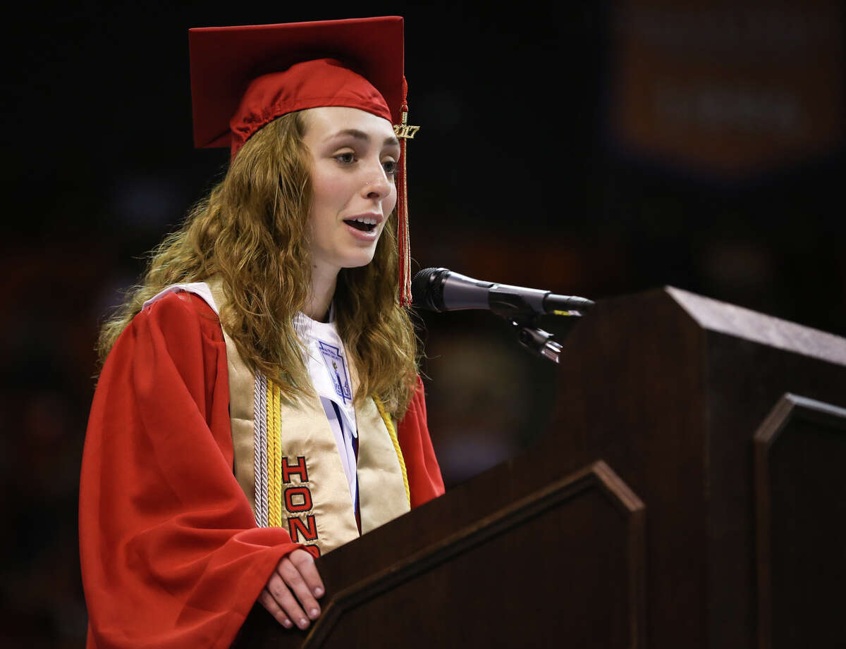 Family and staff cheer on Caney Creek HS graduates