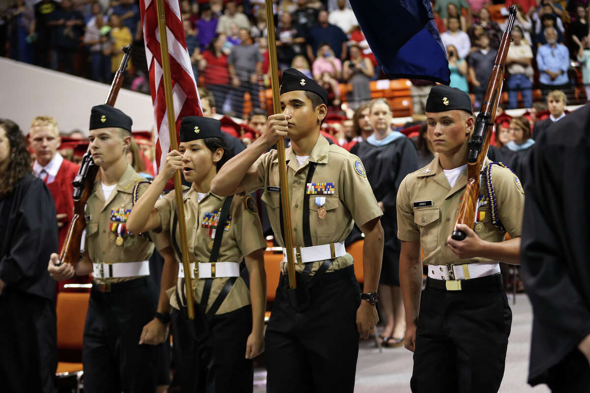 Family and staff cheer on Caney Creek HS graduates