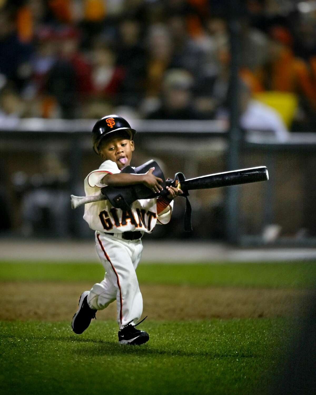 The little batboy who could: Darren Baker, now 18, grows up