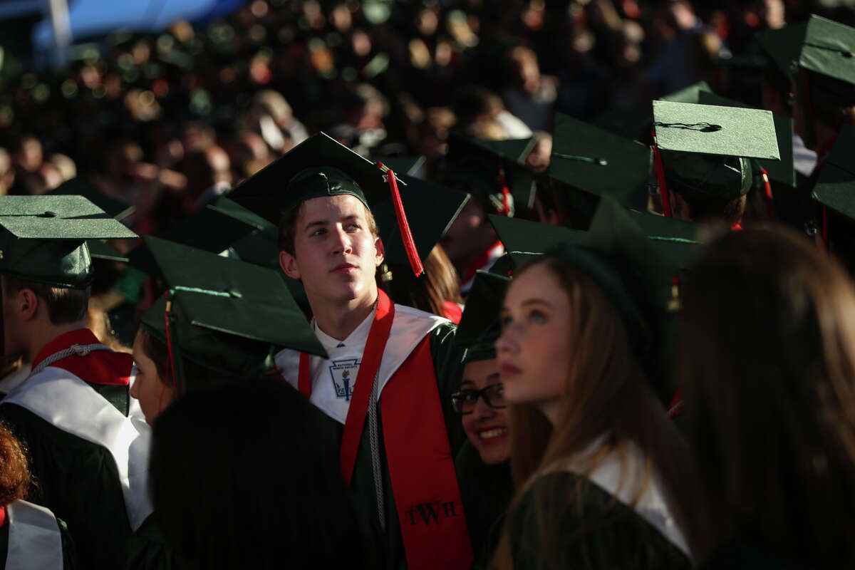 The Woodlands High School graduates rise for Grant Milton