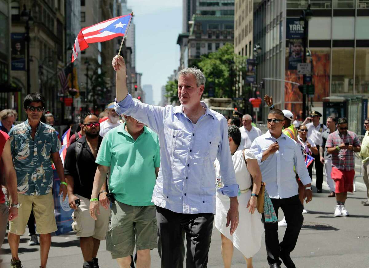 Puerto Rican nationalist booed, cheered in parade
