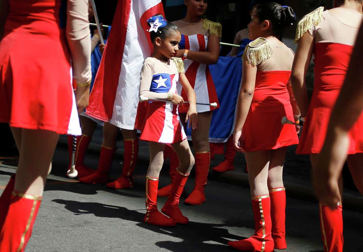Puerto Rican nationalist booed, cheered in parade