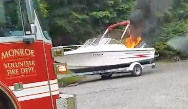 Monroe firefighters extinguish flaming boat