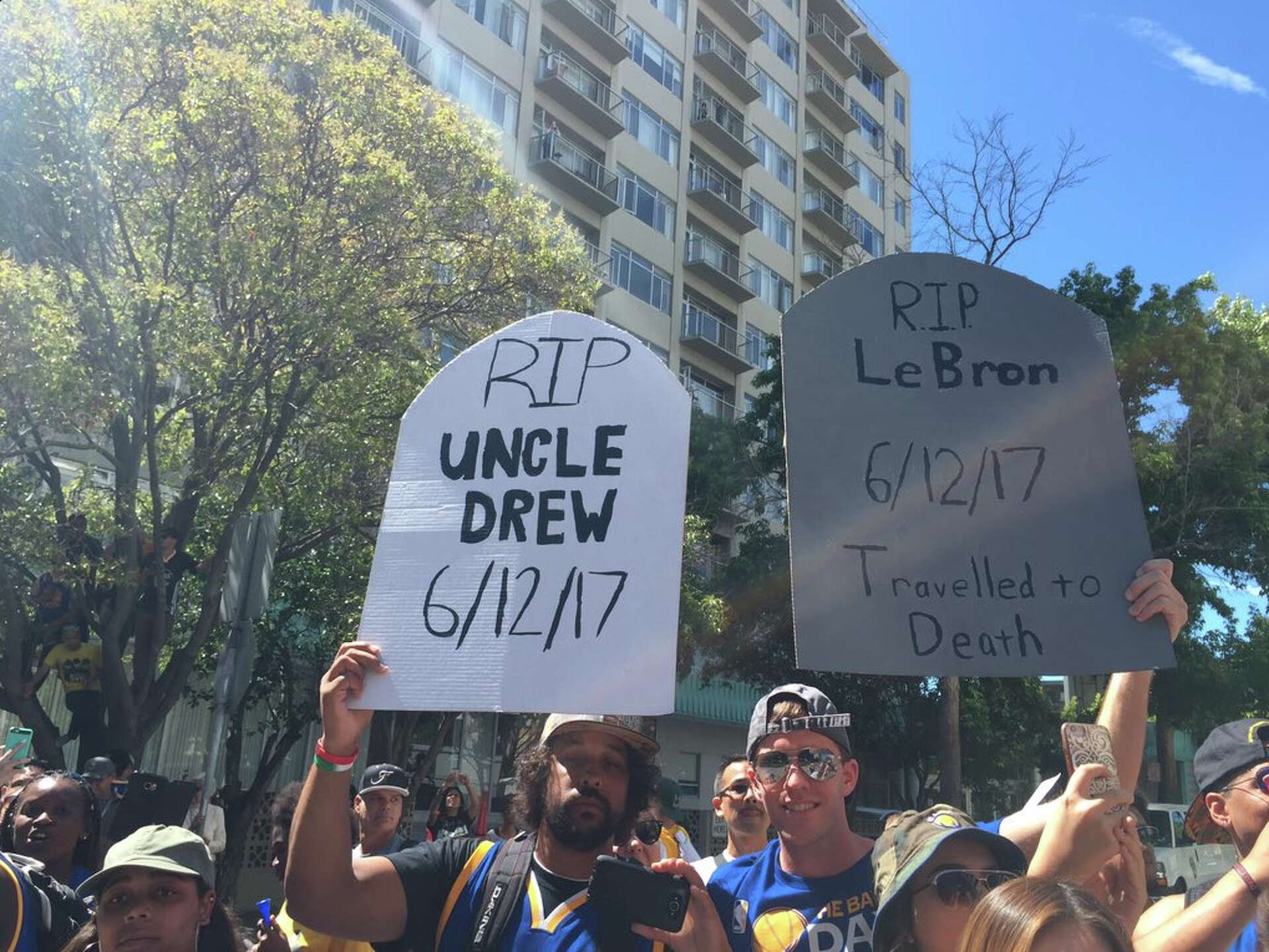 Warriors fans' signs at Thursday's parade get creative, throw shade