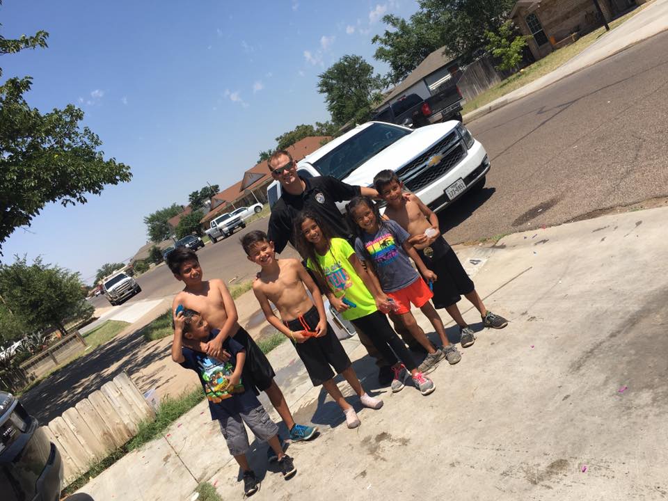 Photo: Texas police officer joins neighborhood water balloon fight