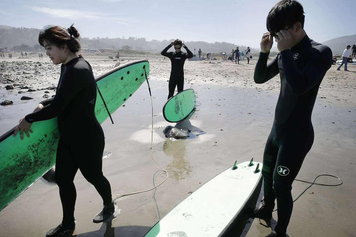 Surfers conquer Pacifica waves on International Surfing Day