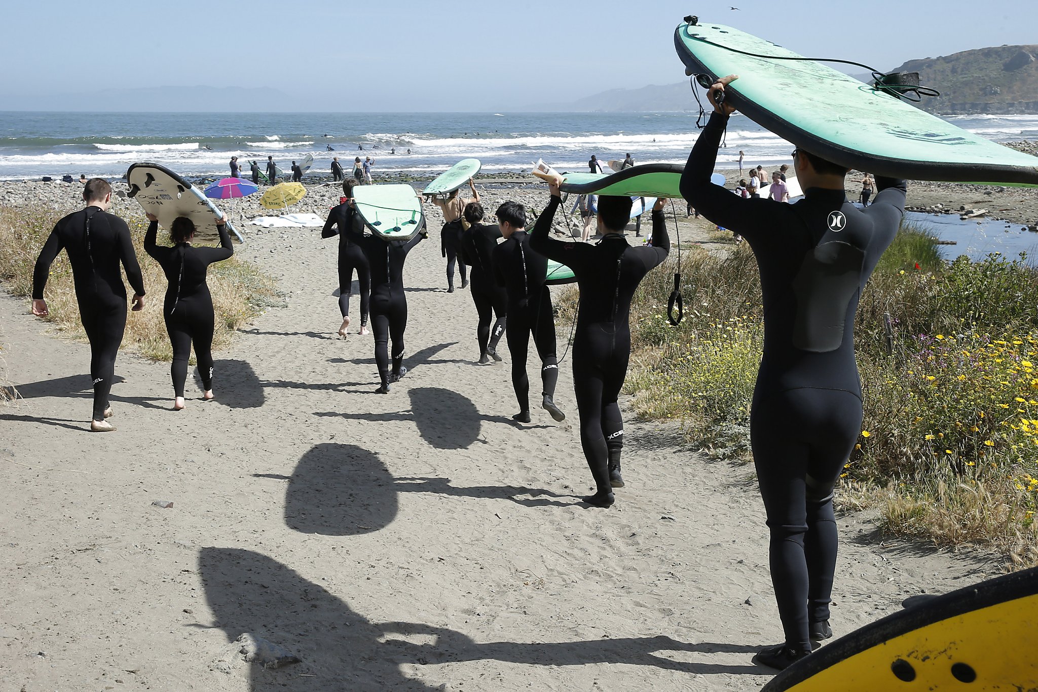Surfers conquer Pacifica waves on International Surfing Day