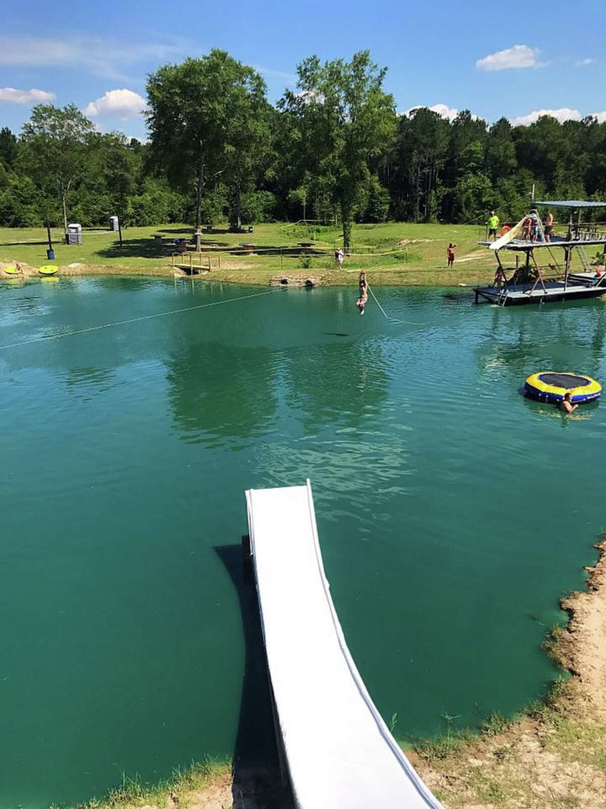 Conroe 'backyard' waterpark turns a swimming hole into a country resort