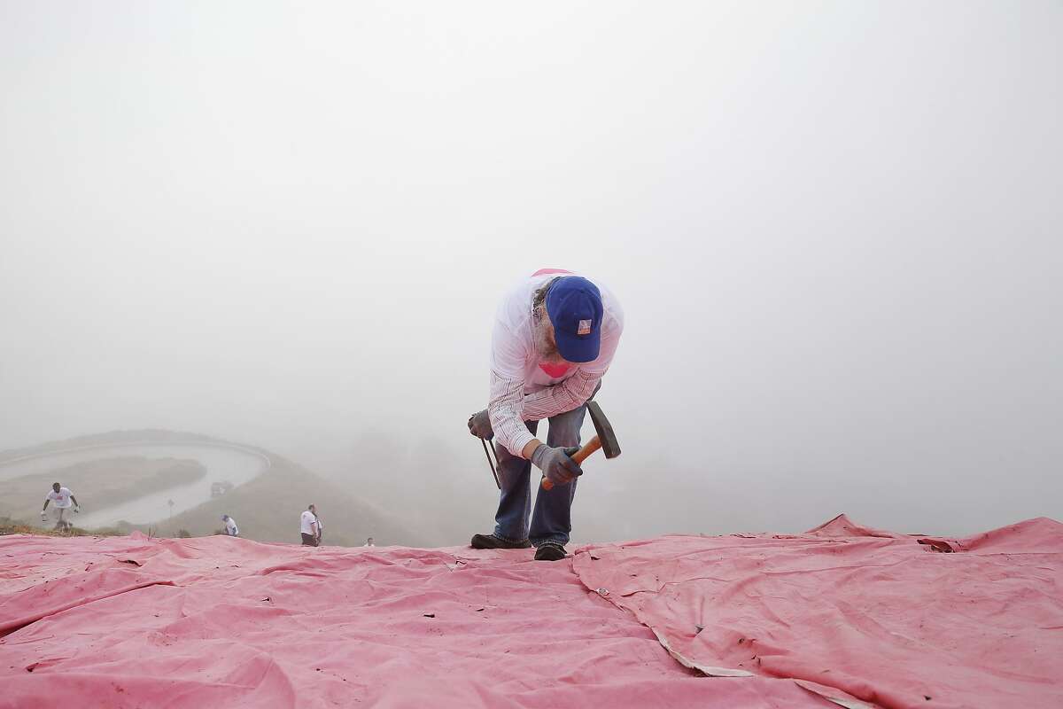 Pink triangle rises again as symbol of pride for LGBT community