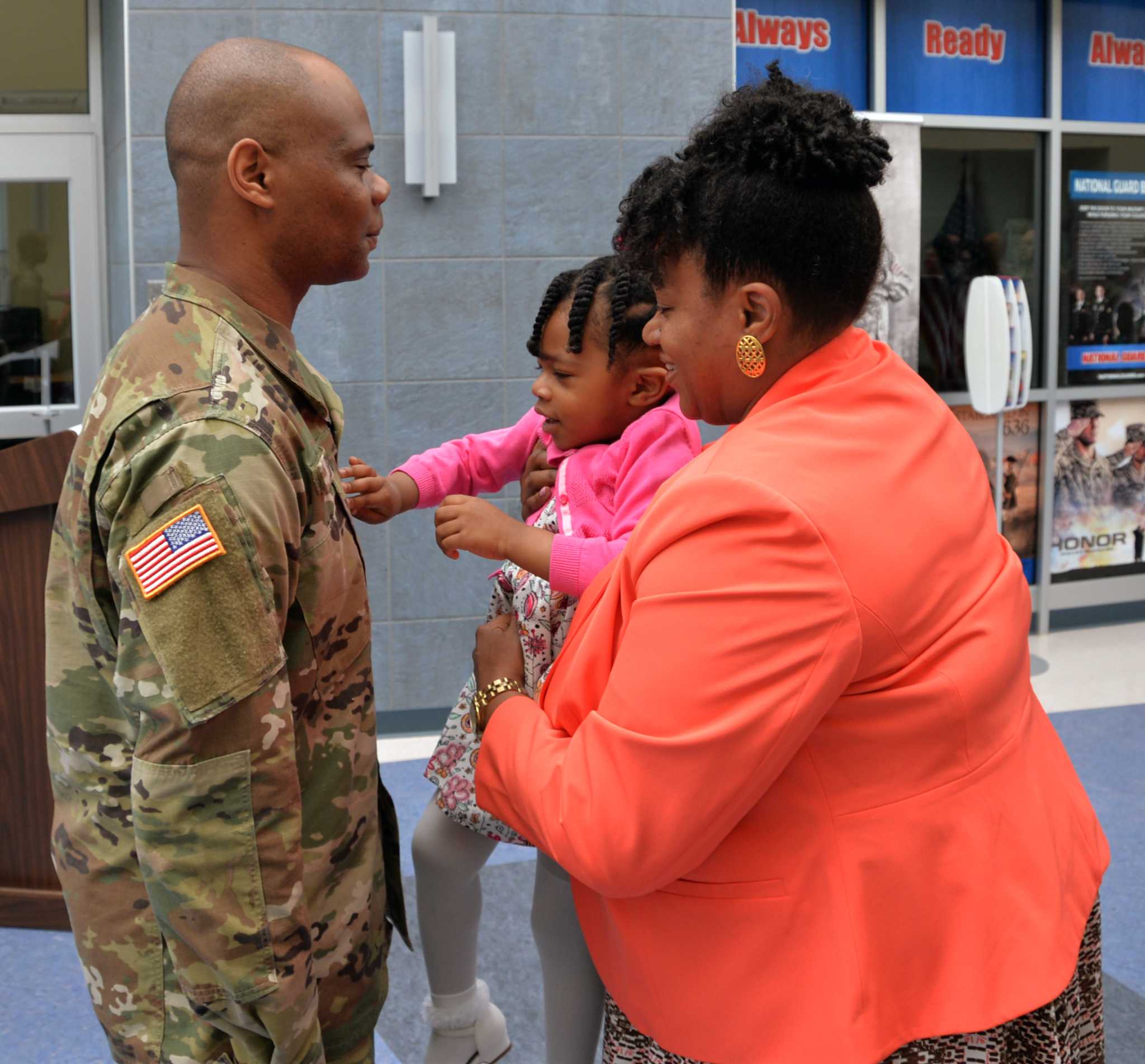 Two Army National Guard soldiers advance as warrant officers