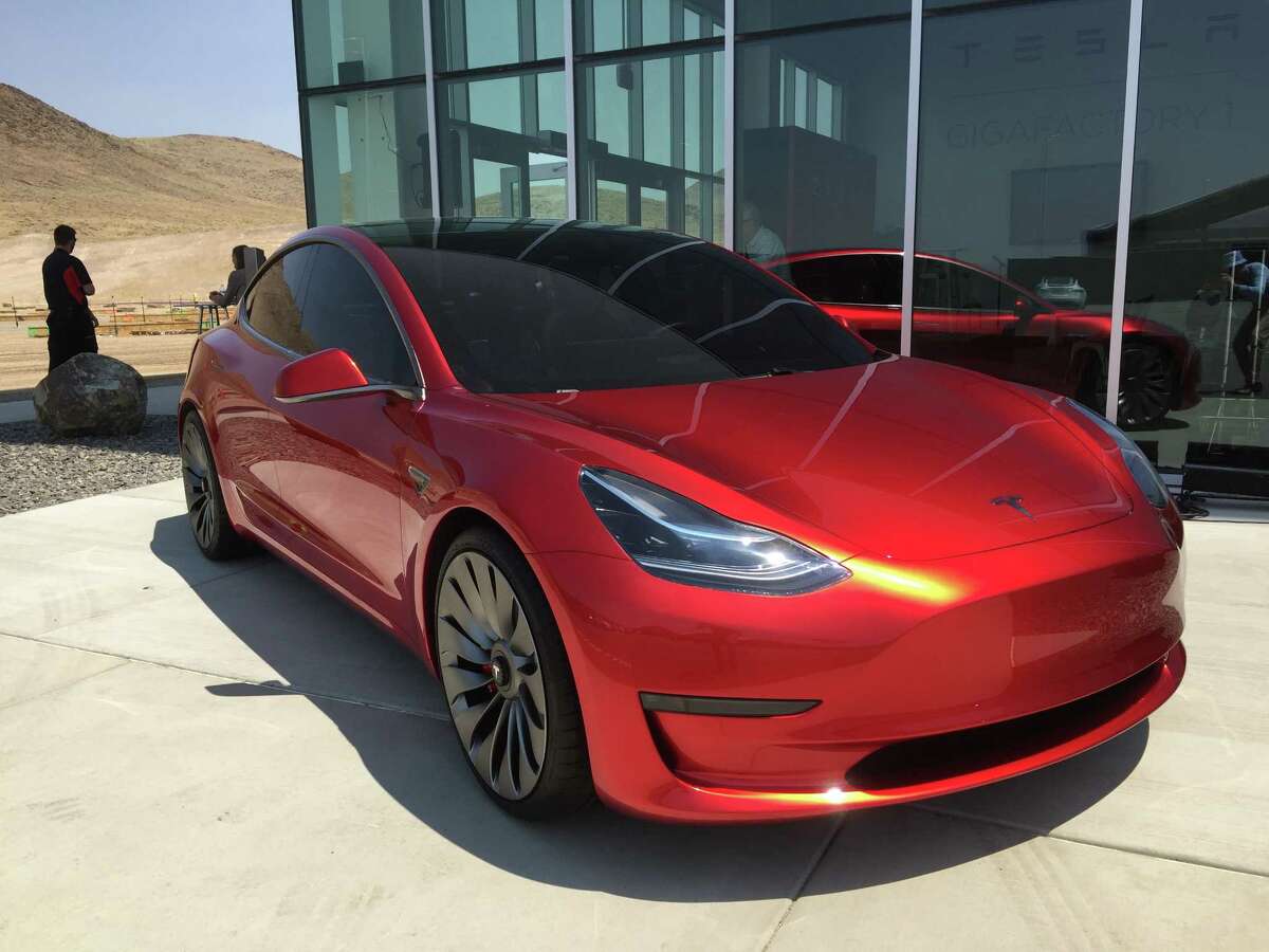 Tesla says first Model 3 to come off assembly line Friday