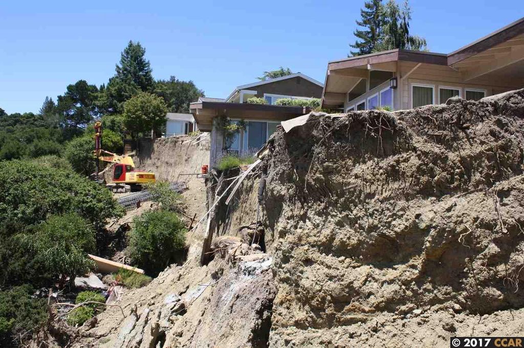 Red-tagged house perched atop a landslide lists at $850k