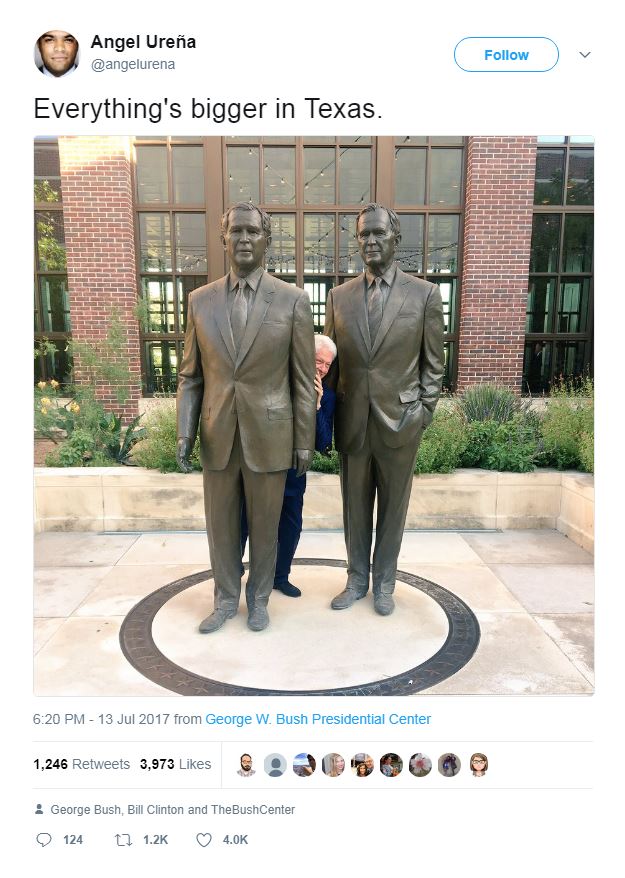 'Everything's bigger in Texas' Clinton poses between Bushes