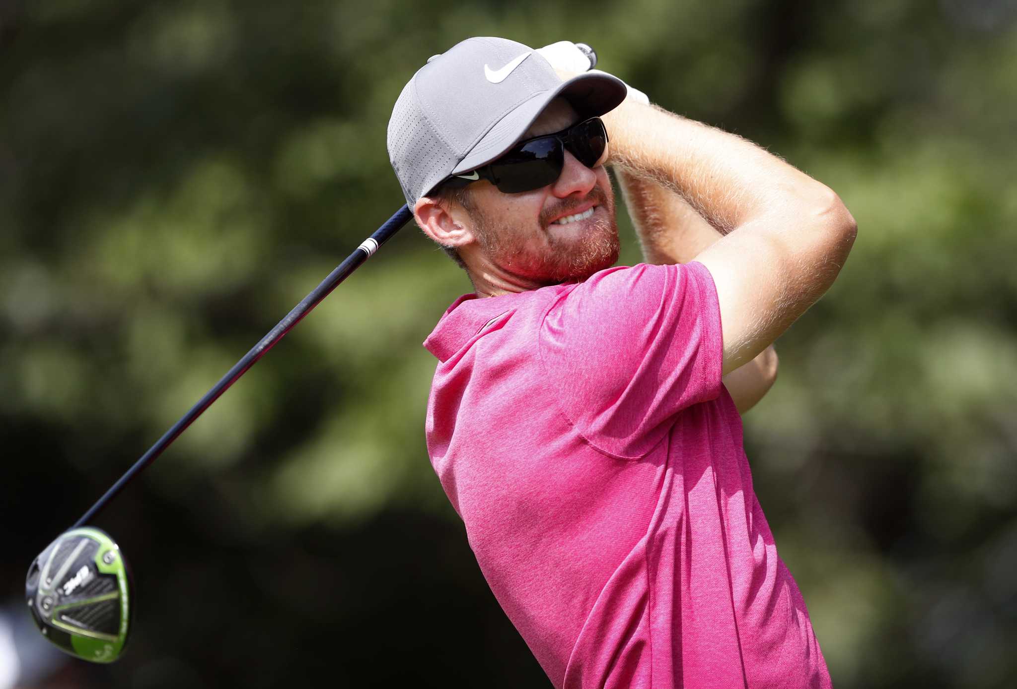 GOLF: Rodgers maintains 2-stroke lead at John Deere Classic