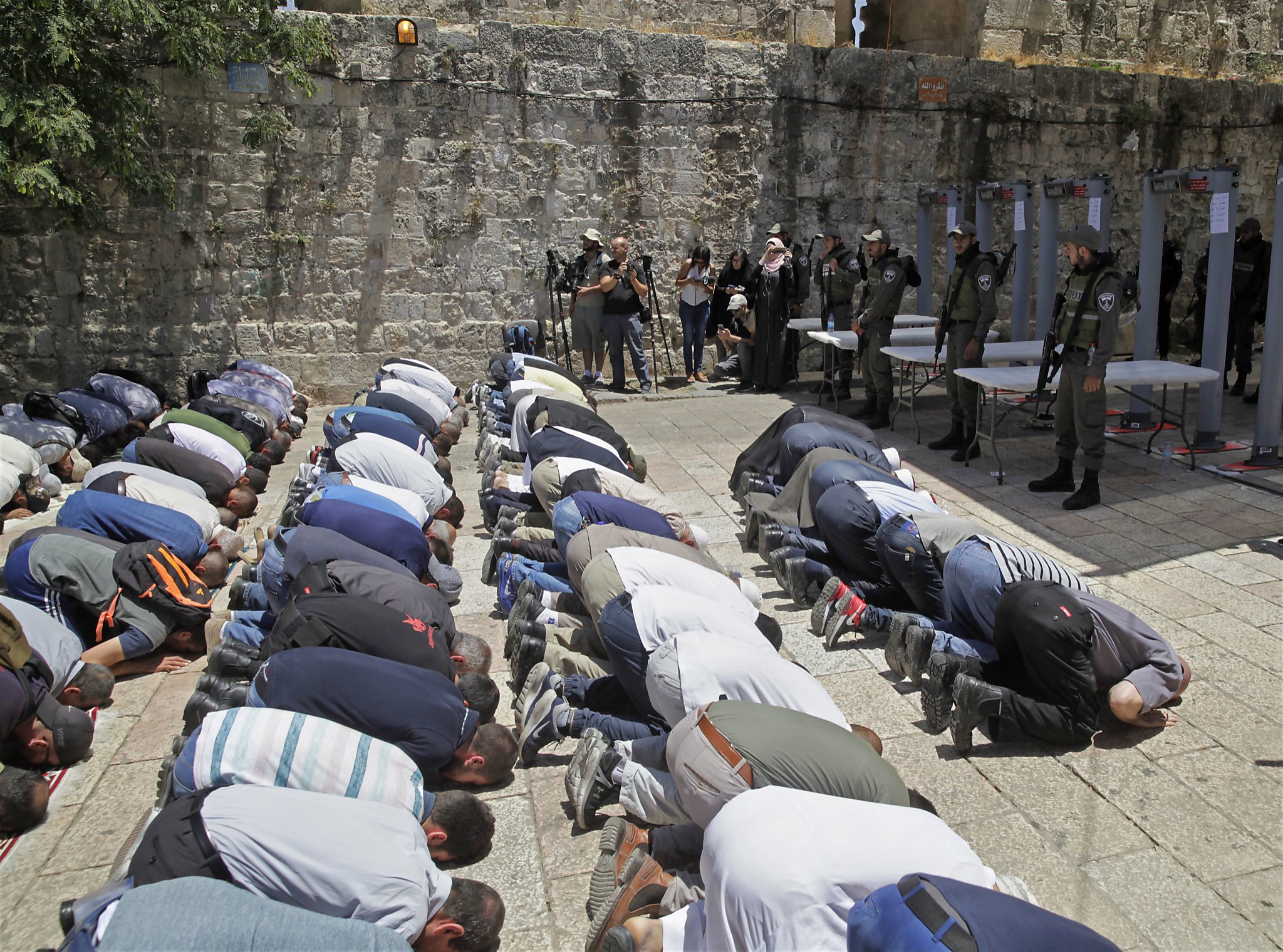 Jerusalem holy site reopens after attack amid tension over security