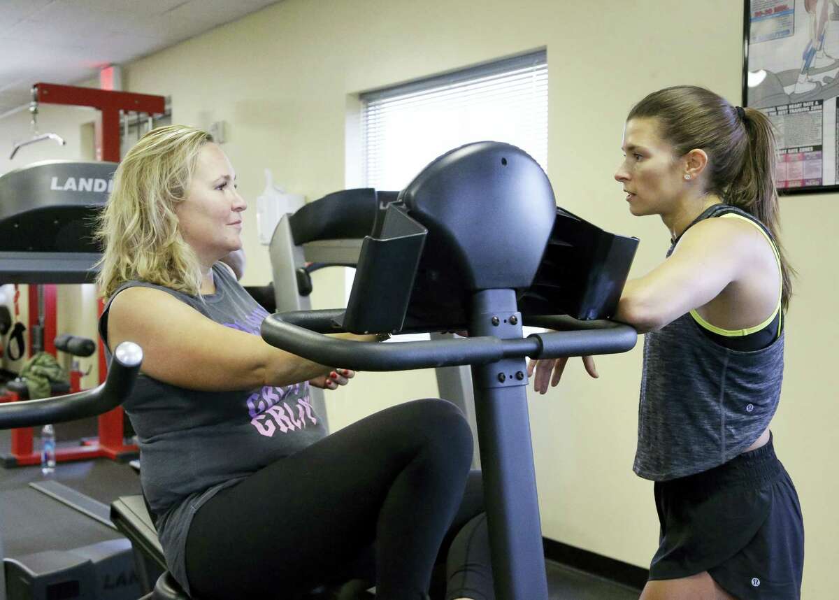 Eye on the future, Danica Patrick races into fitness space