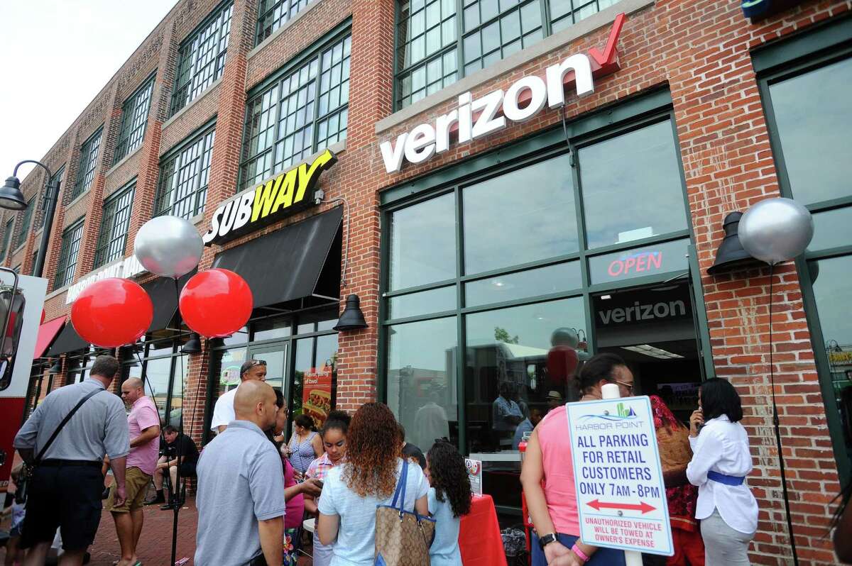 Local Verizon stores pitch in for local book bag giveaway