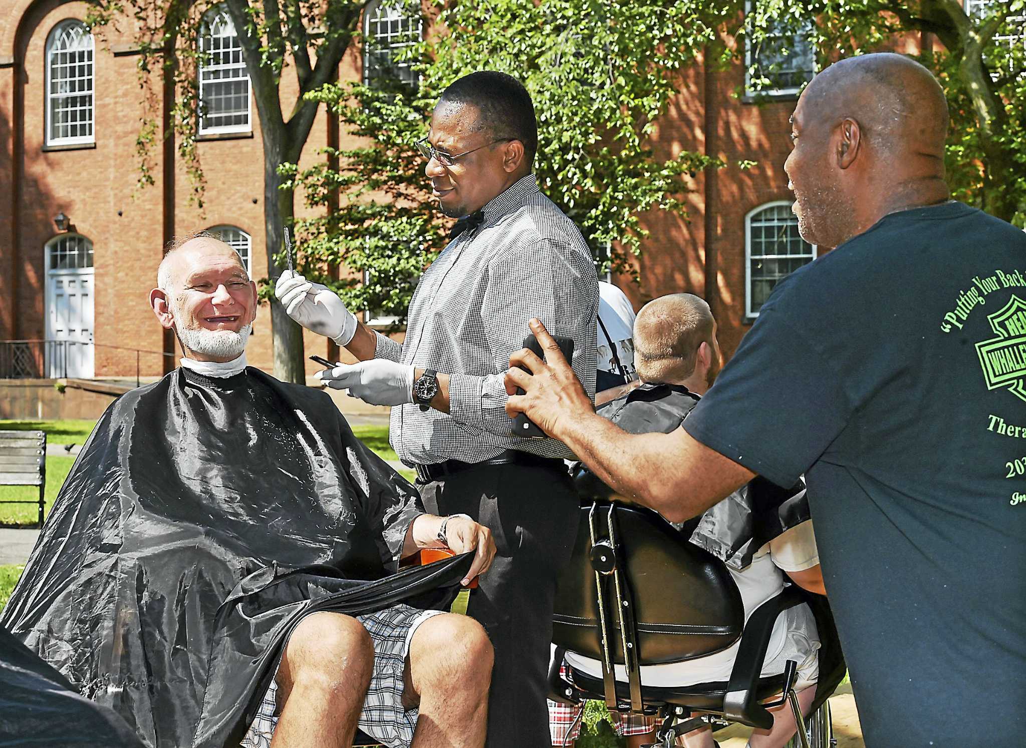 Free haircuts for homeless on New Haven Green bring smiles, new styles
