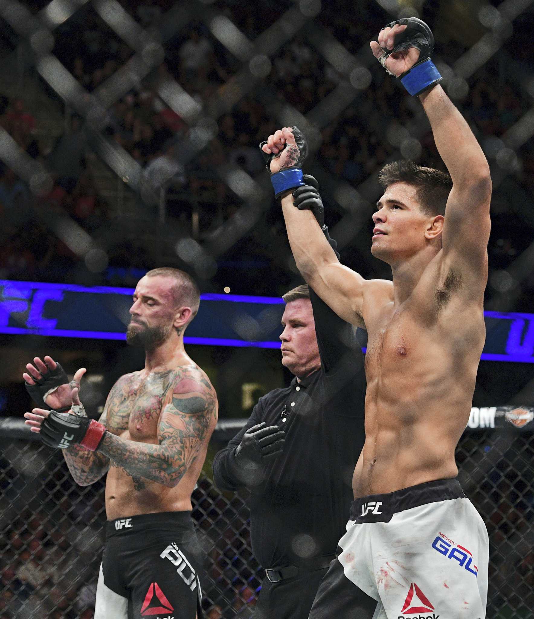 Former wrestling superstar CM Punk pounded in UFC debut