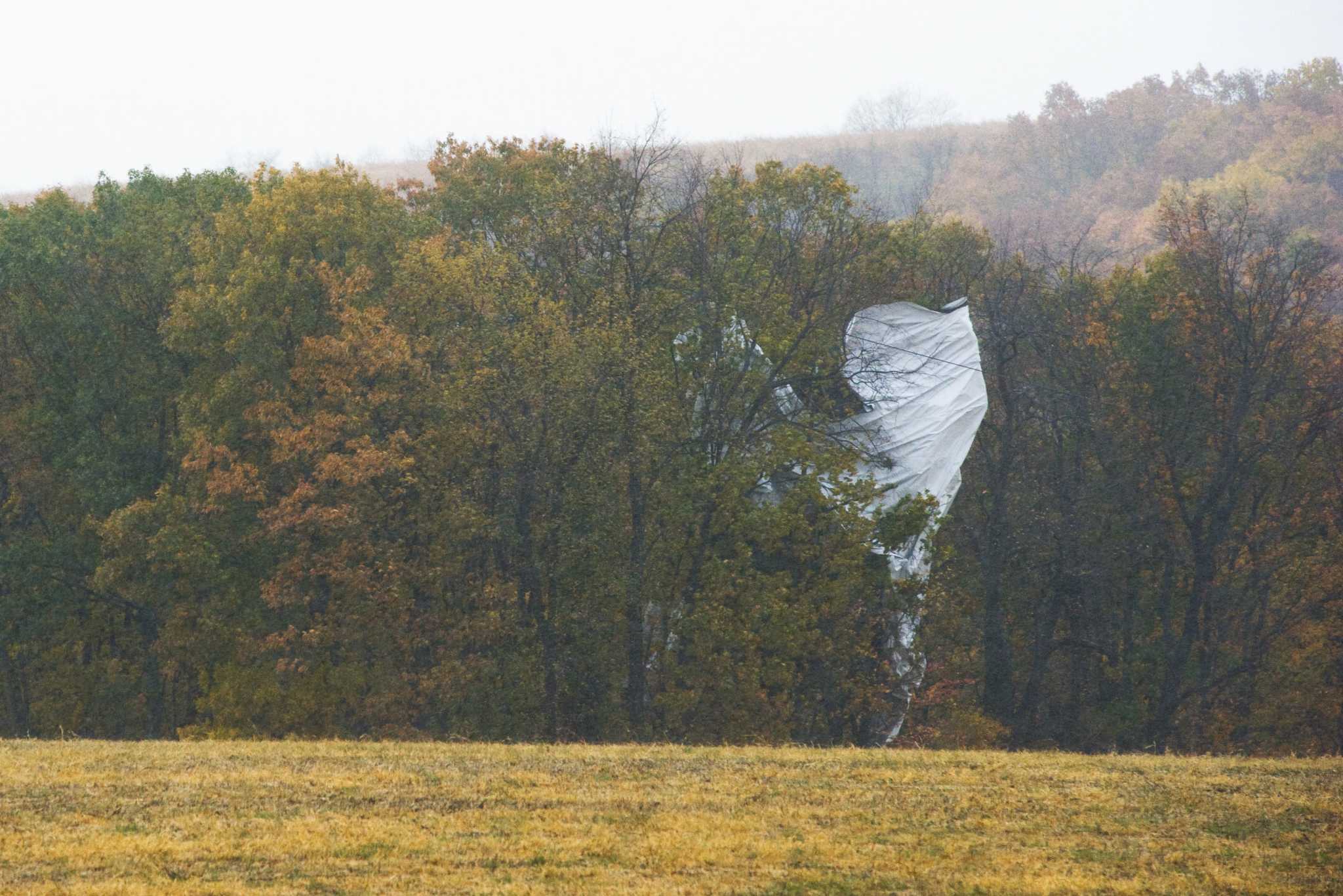 Pennsylvania State Police using shotguns to deflate grounded blimp