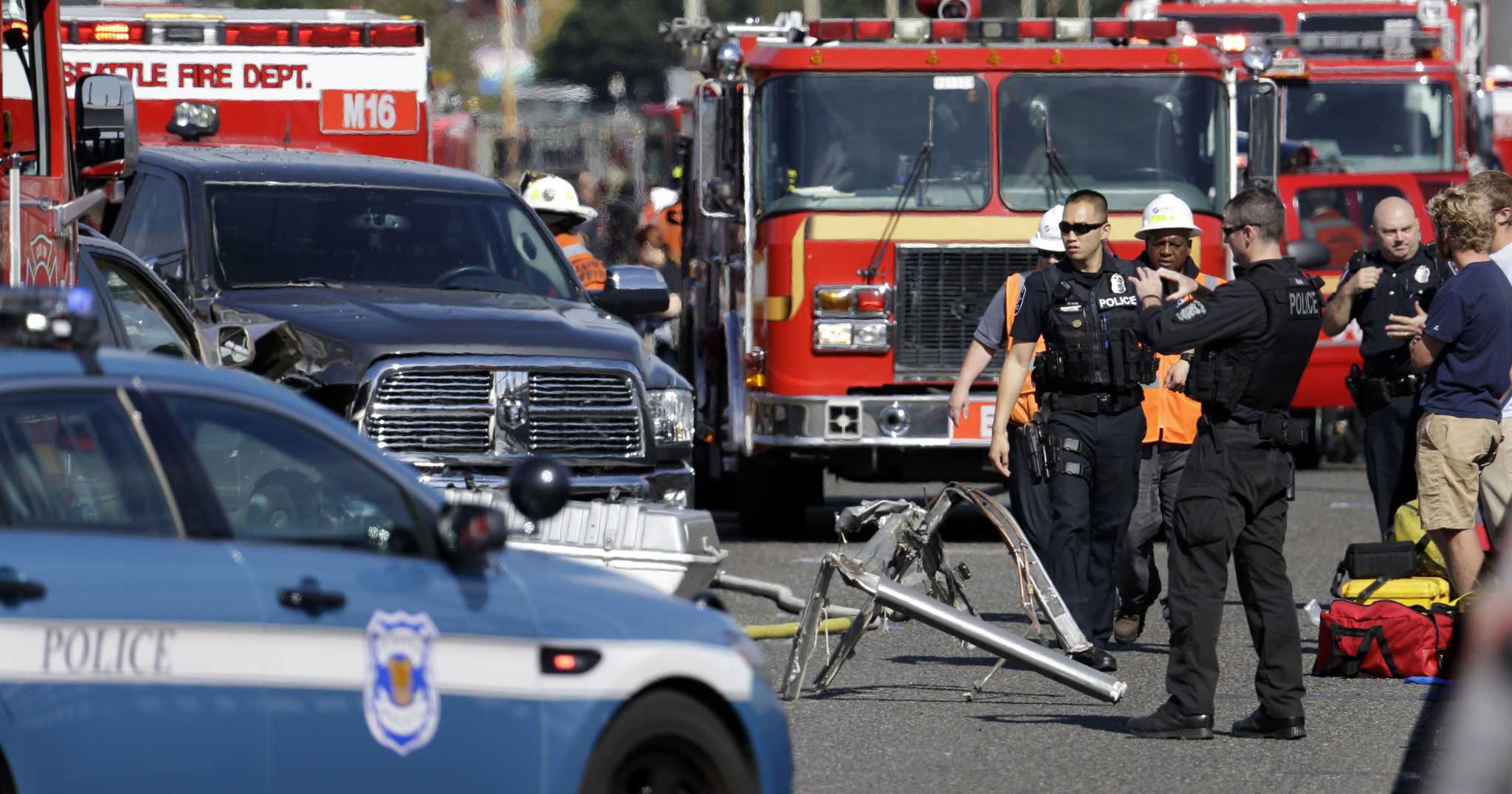 Buses collide on Seattle bridge, killing 4, injuring dozens