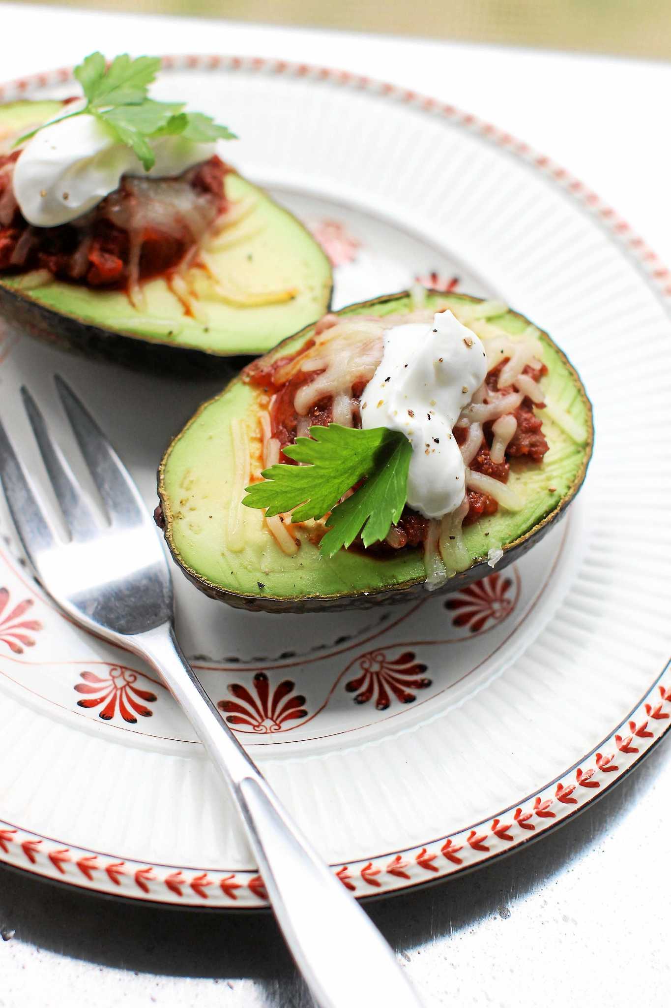 Stuff avocados with a quick chili and top with cheese