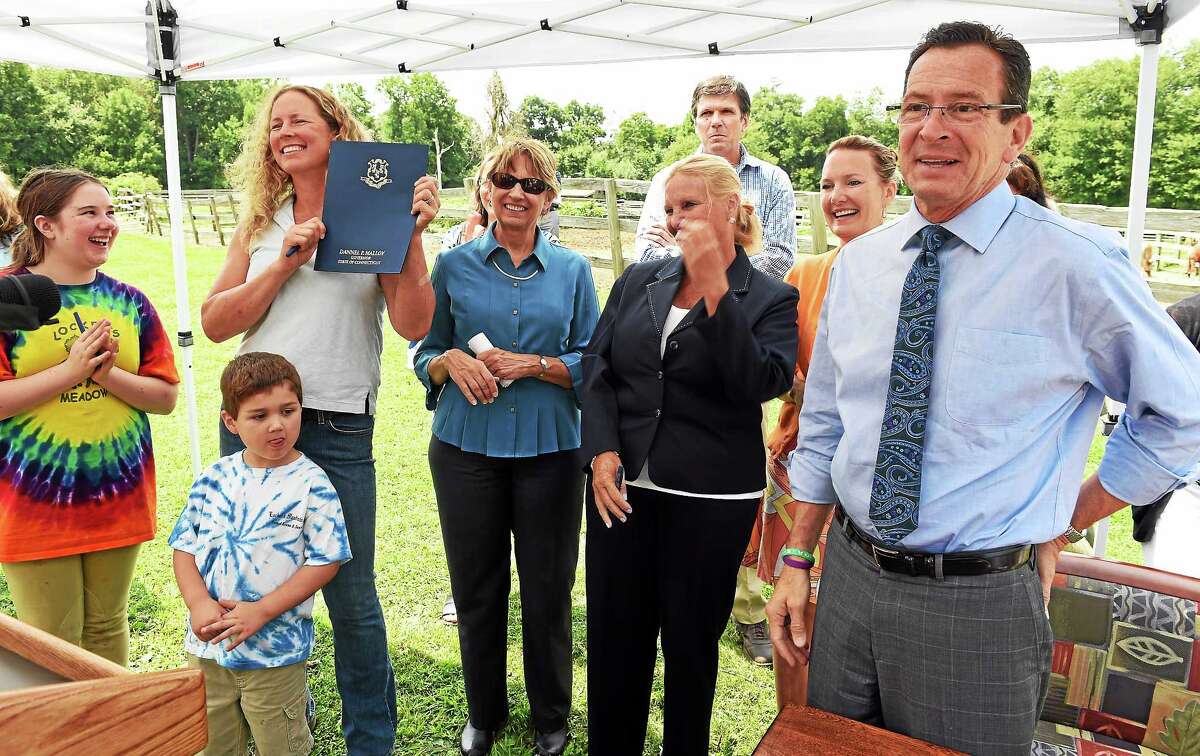 Connecticut governor commemorates law protecting horse owners, handlers