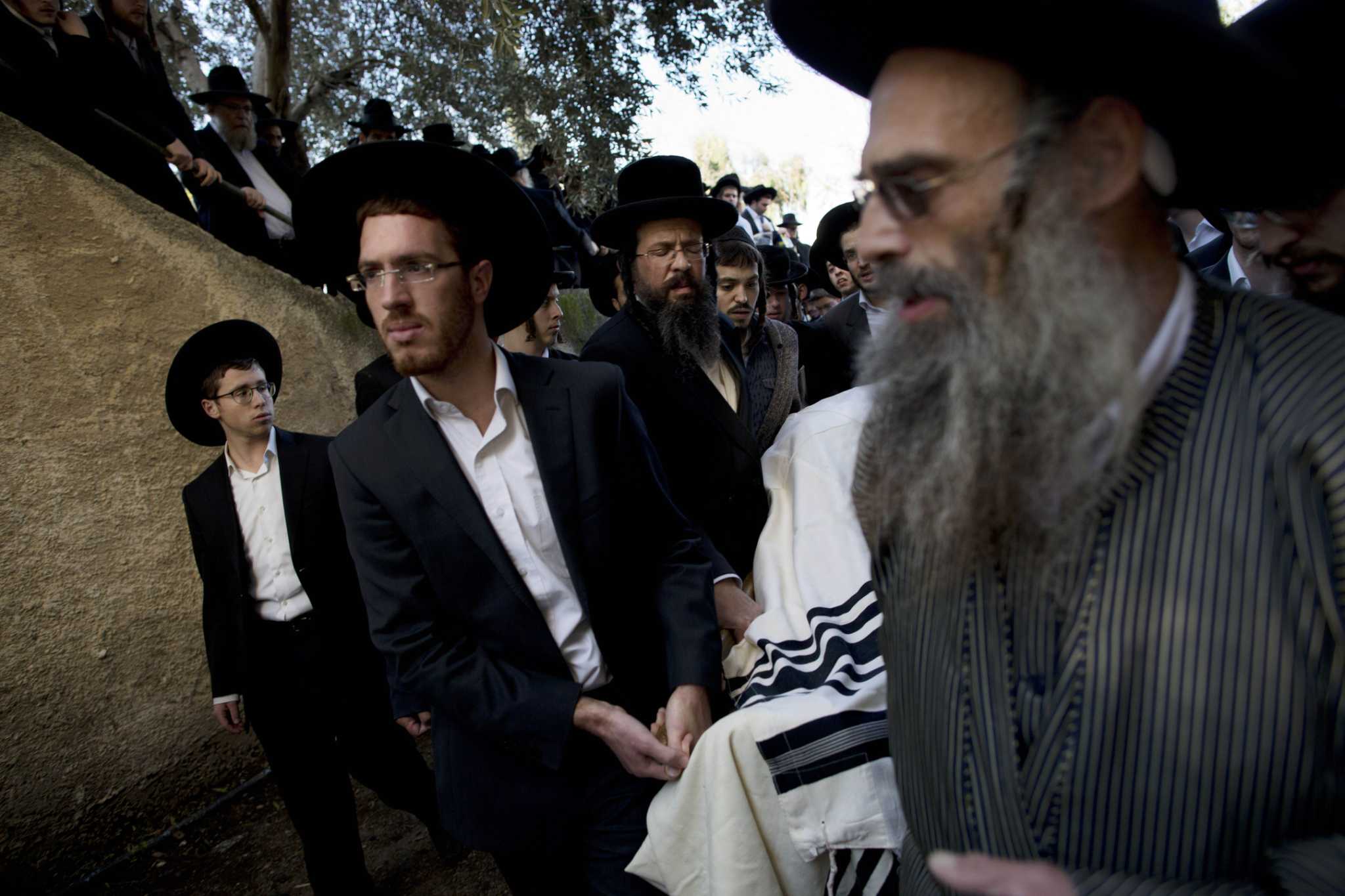 Israel vows tough response to slaughter of 4 rabbis in Jerusalem synagogue