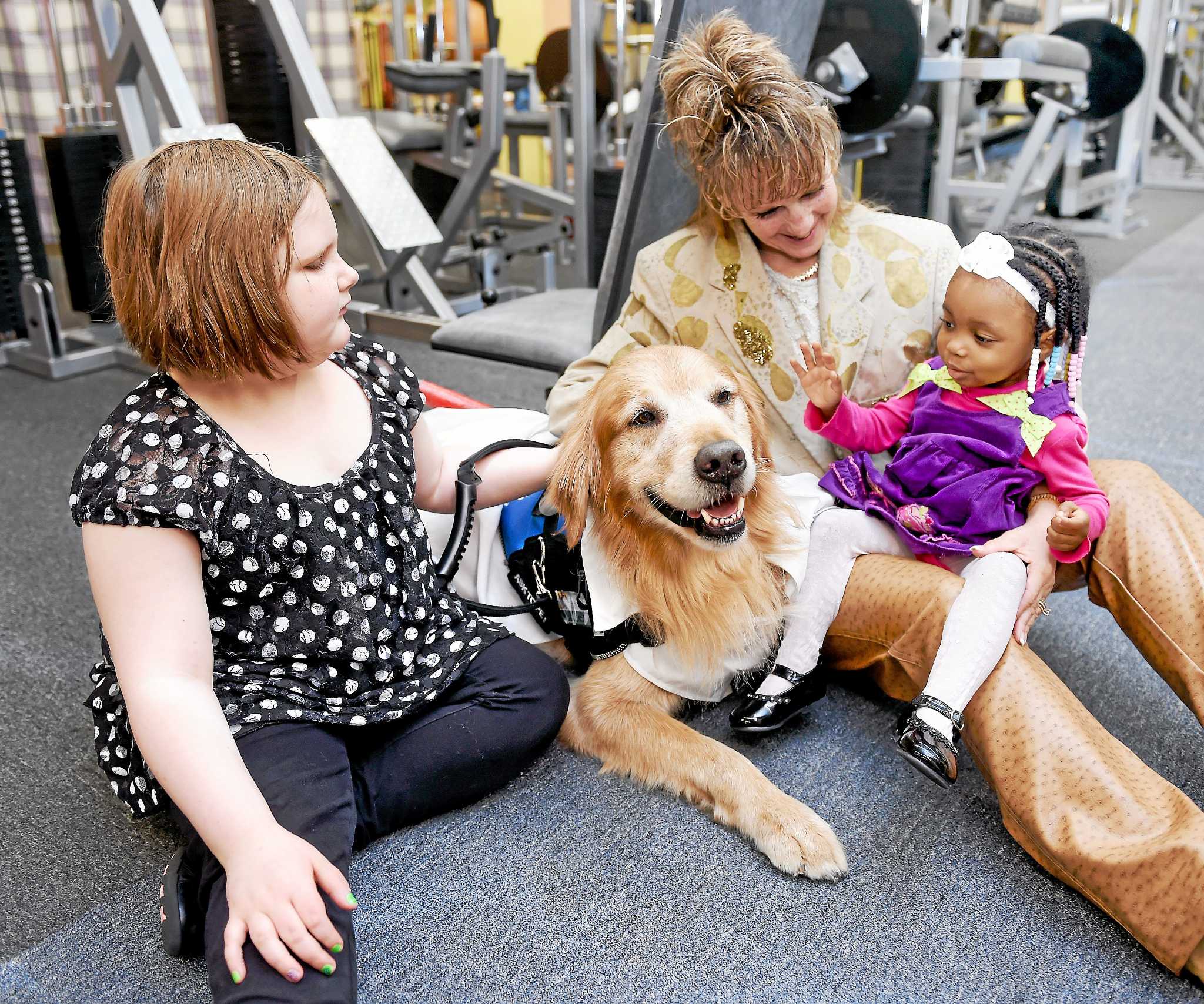 Blue, the therapy dog, helps kids, vets and others at West Haven facility