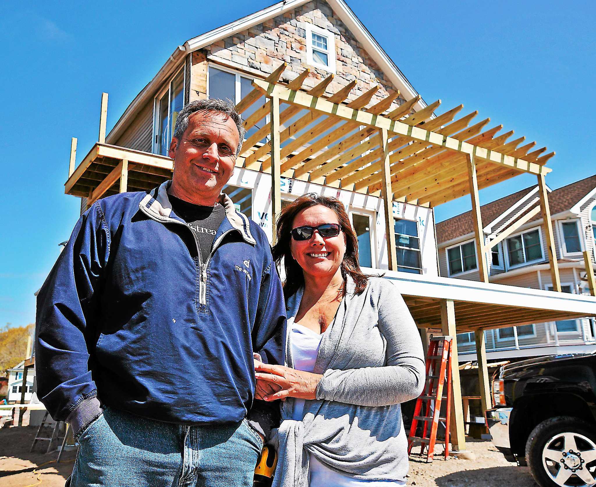 Connecticut shoreline residents lift their homes after Irene and Sandy
