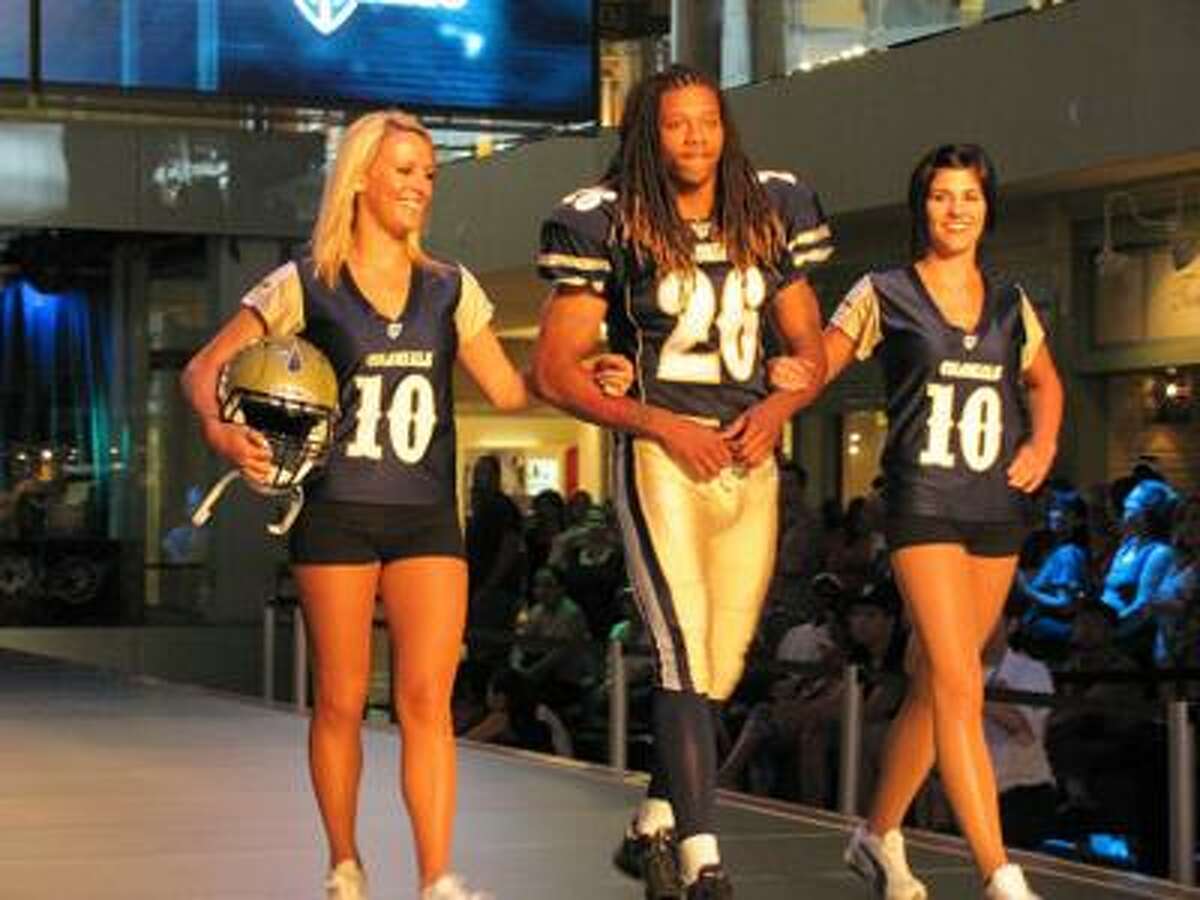 Former UConn football star Dixon models new Colonials uniforms